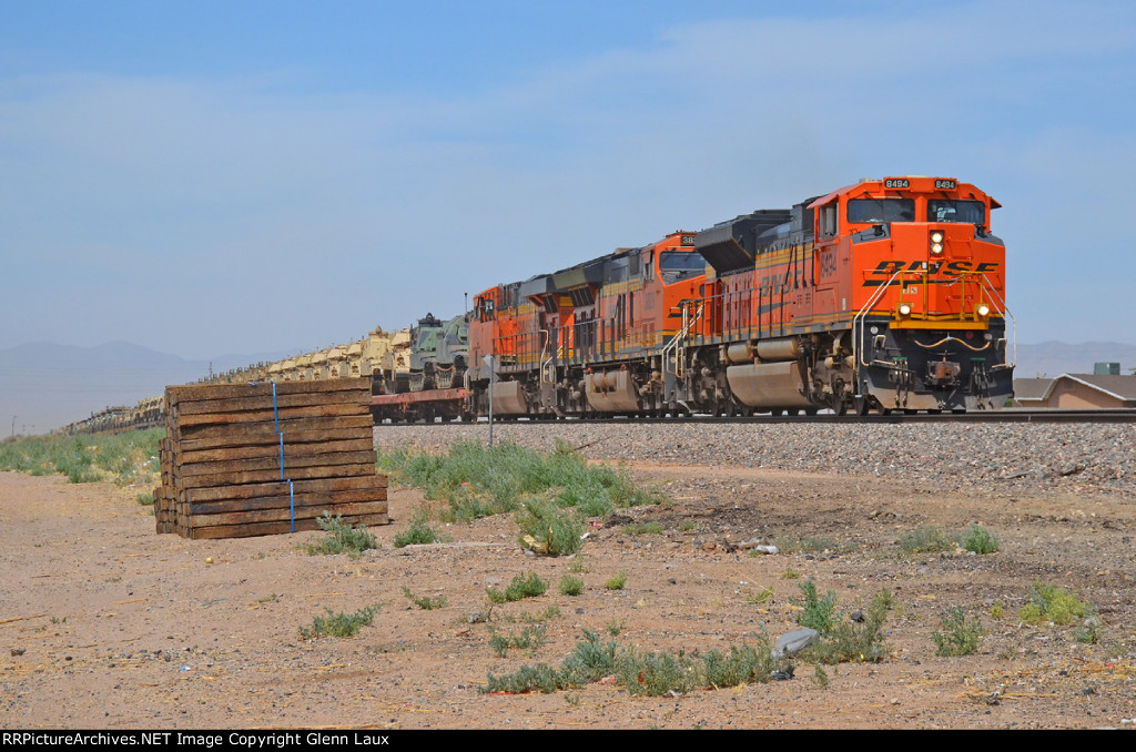 BNSF 8494 Leads a military train westbound, possibly enroute to NTC.